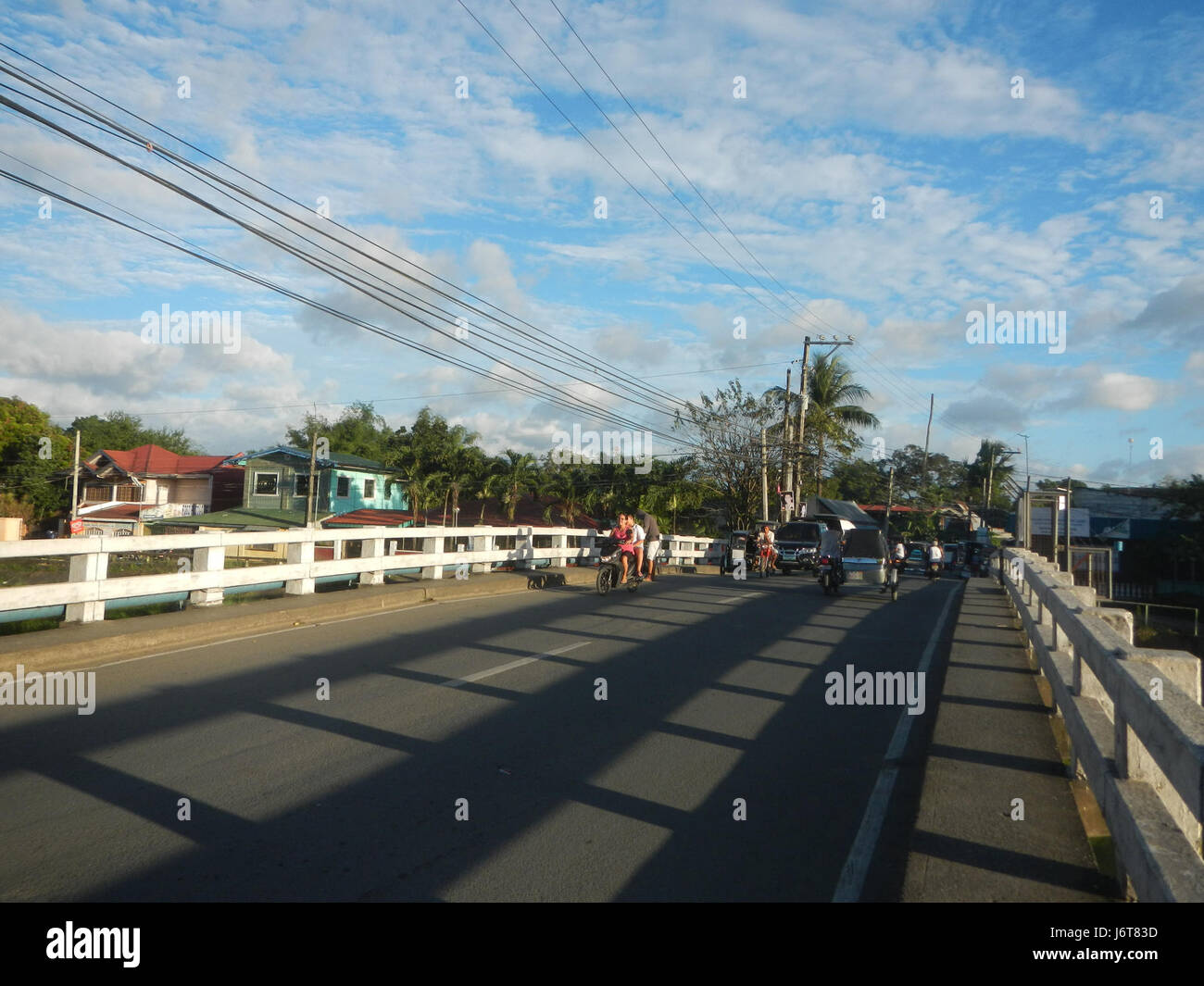 The photograph captures a stunning sunset over the San Miguel Bridge in ...