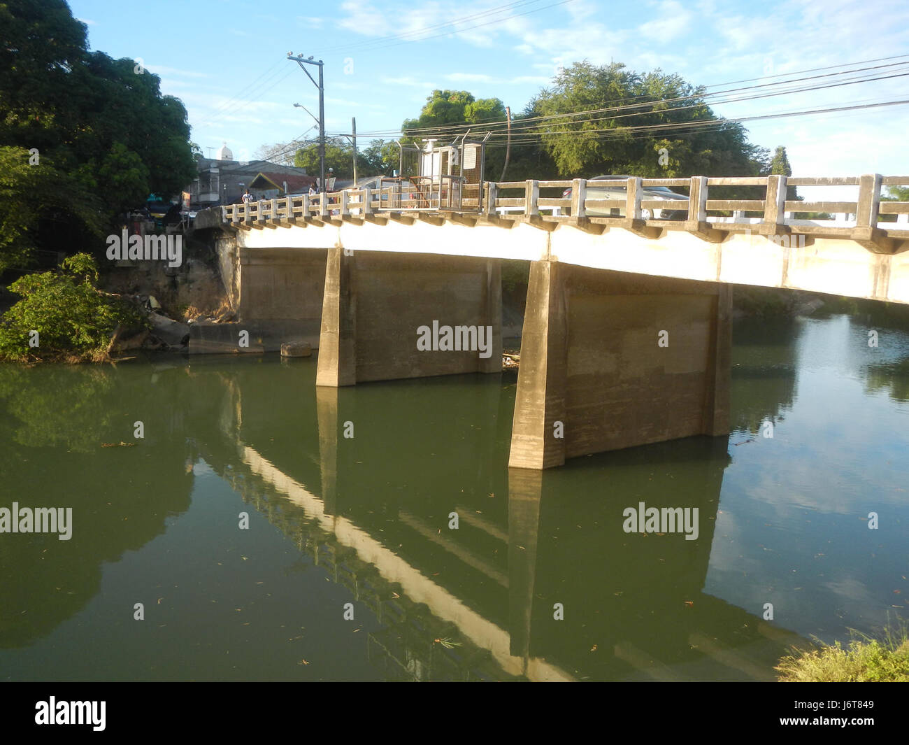 The view captures the serene sunset over the San Miguel Bridge ...