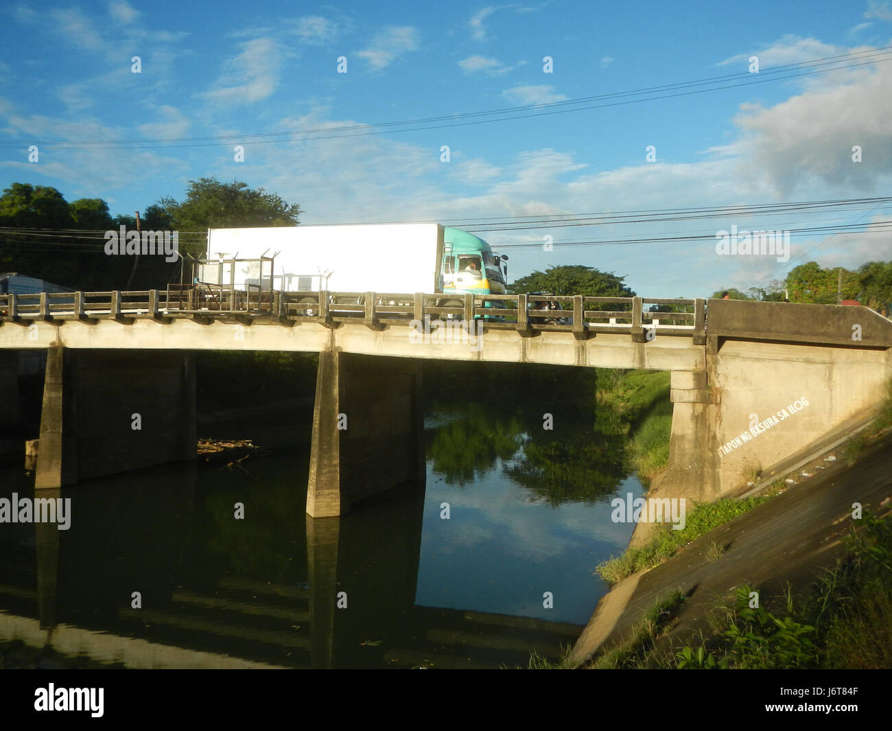 The view of the sunset over the San Miguel Bridge and San Juan River in ...