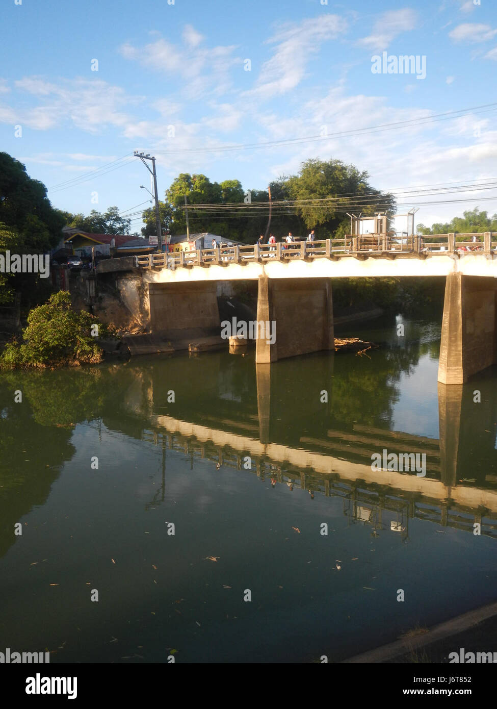 This image captures a sunset over San Miguel Bridge, located across the ...