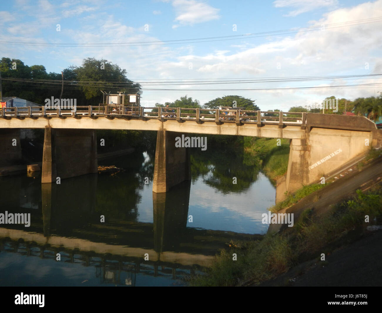 This image captures the tranquil sunset view from the San Miguel Bridge ...