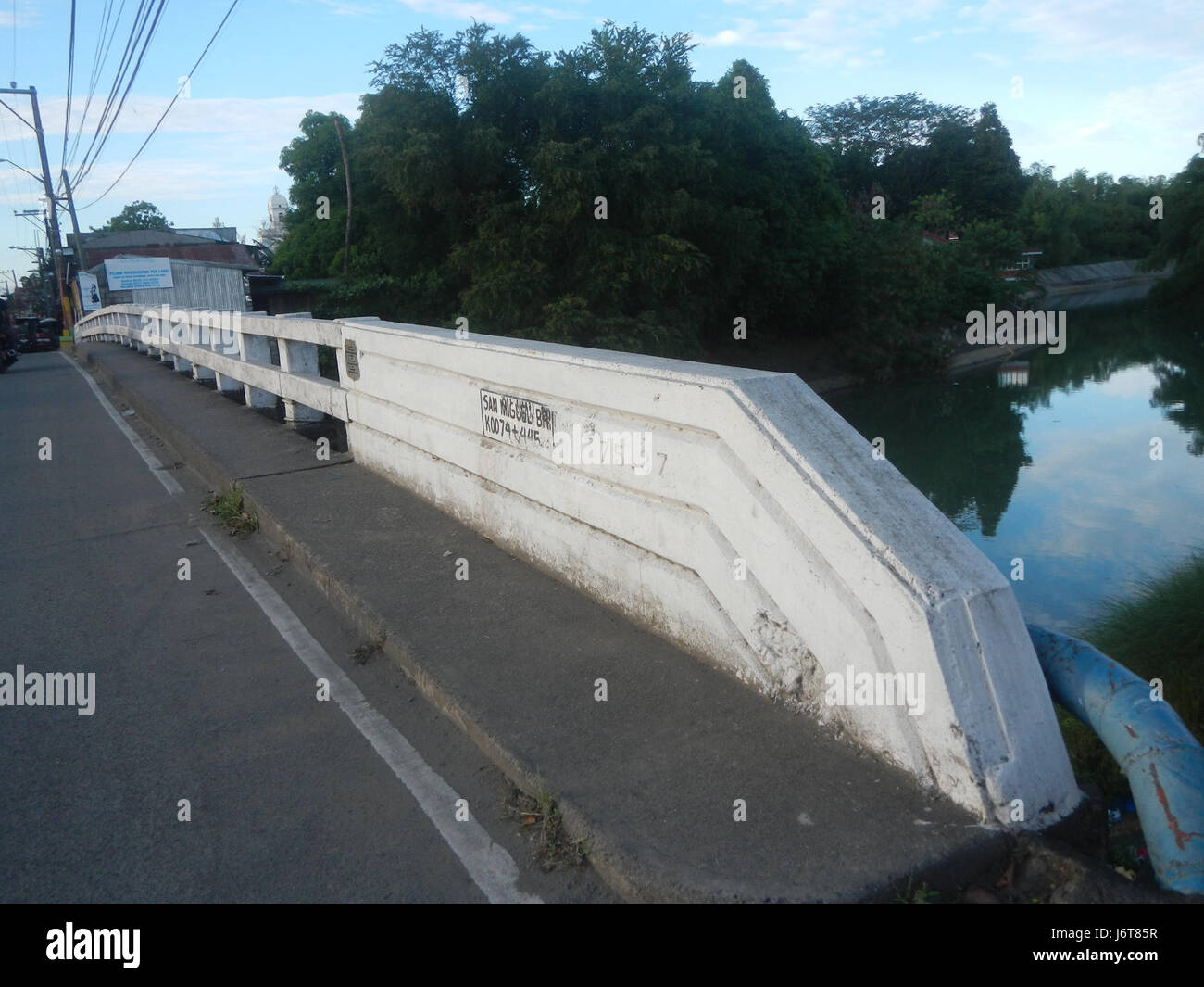 This photograph captures the vibrant sunset over San Miguel Bridge ...