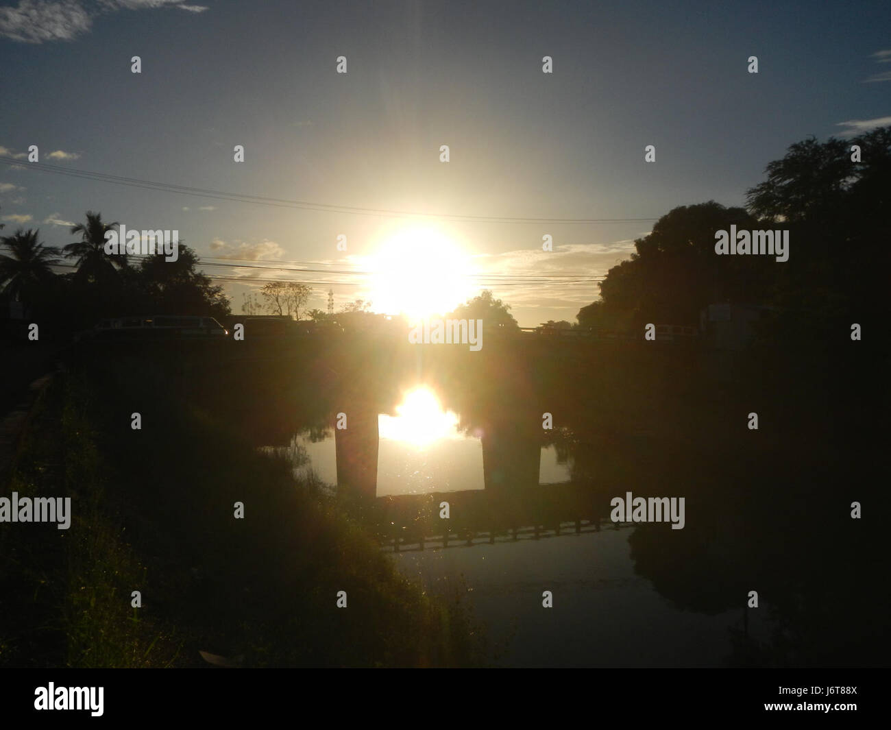 This image captures a sunset view from the San Miguel Bridge over the ...