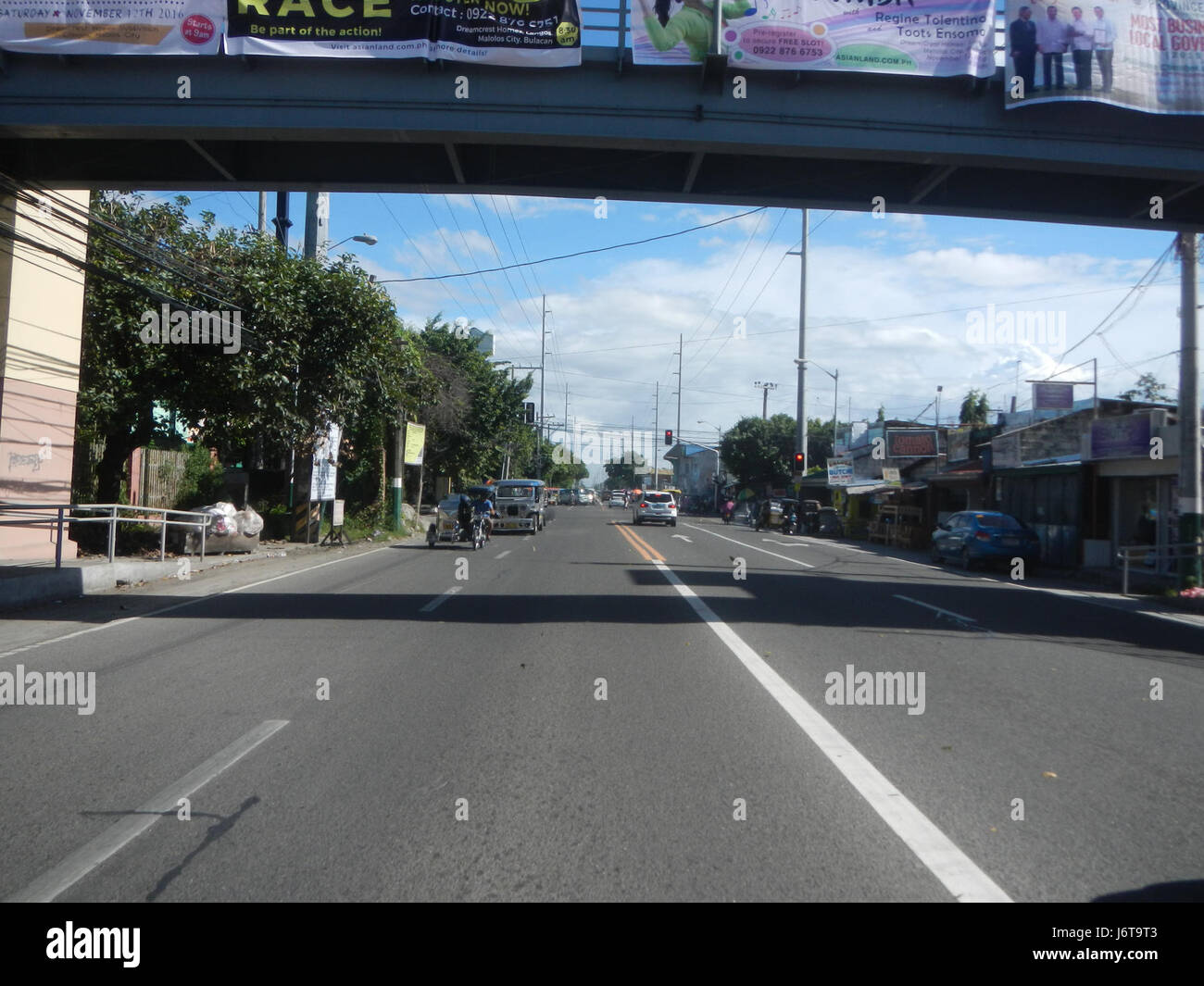 This image features a section of the MacArthur Highway in Malolos ...