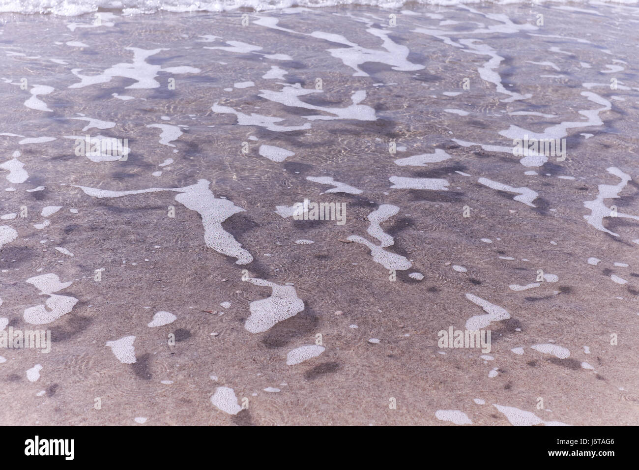 Very clear sea water, you can see the sand Stock Photo - Alamy