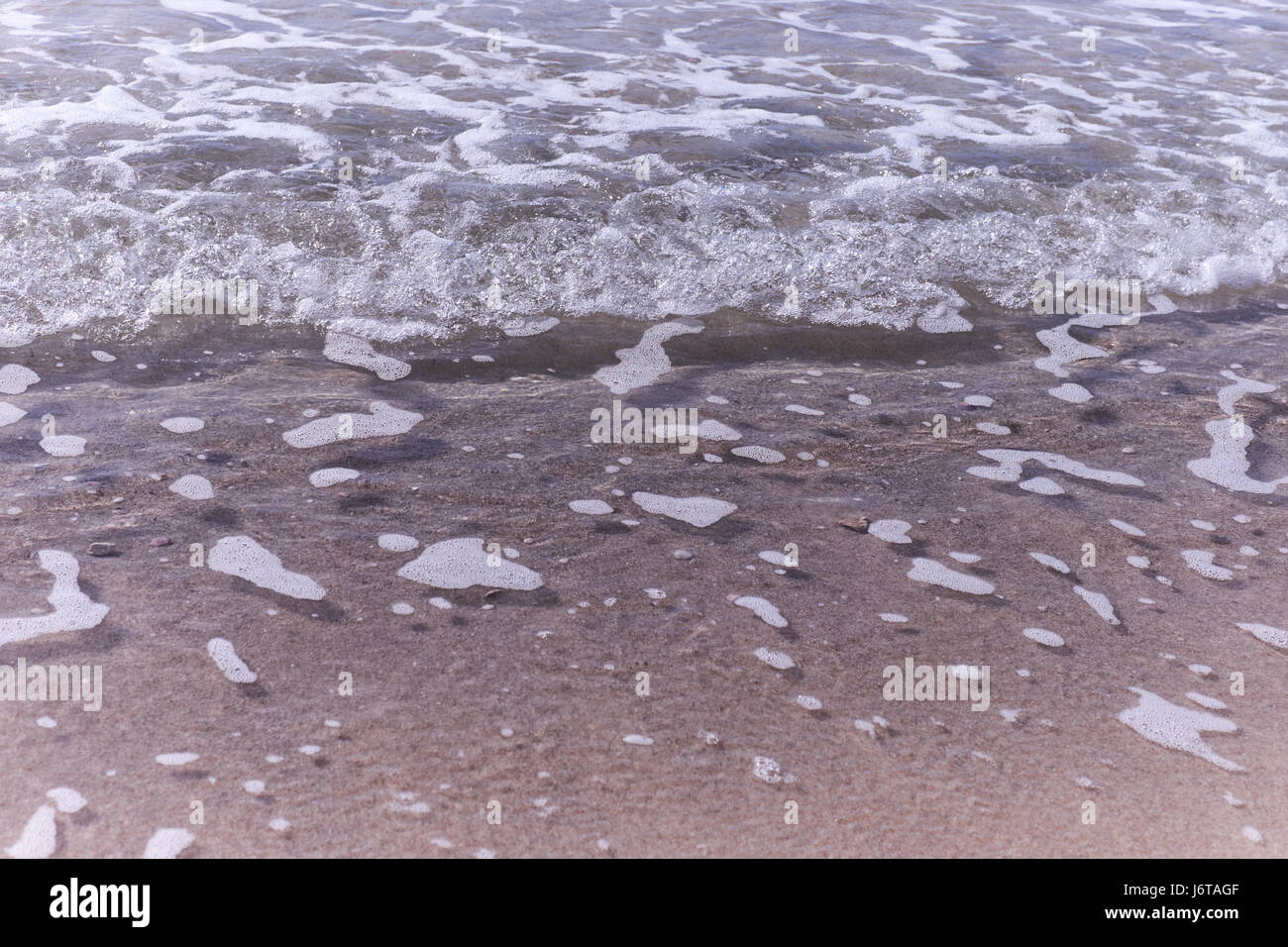 Very clear sea water, you can see the sand Stock Photo - Alamy