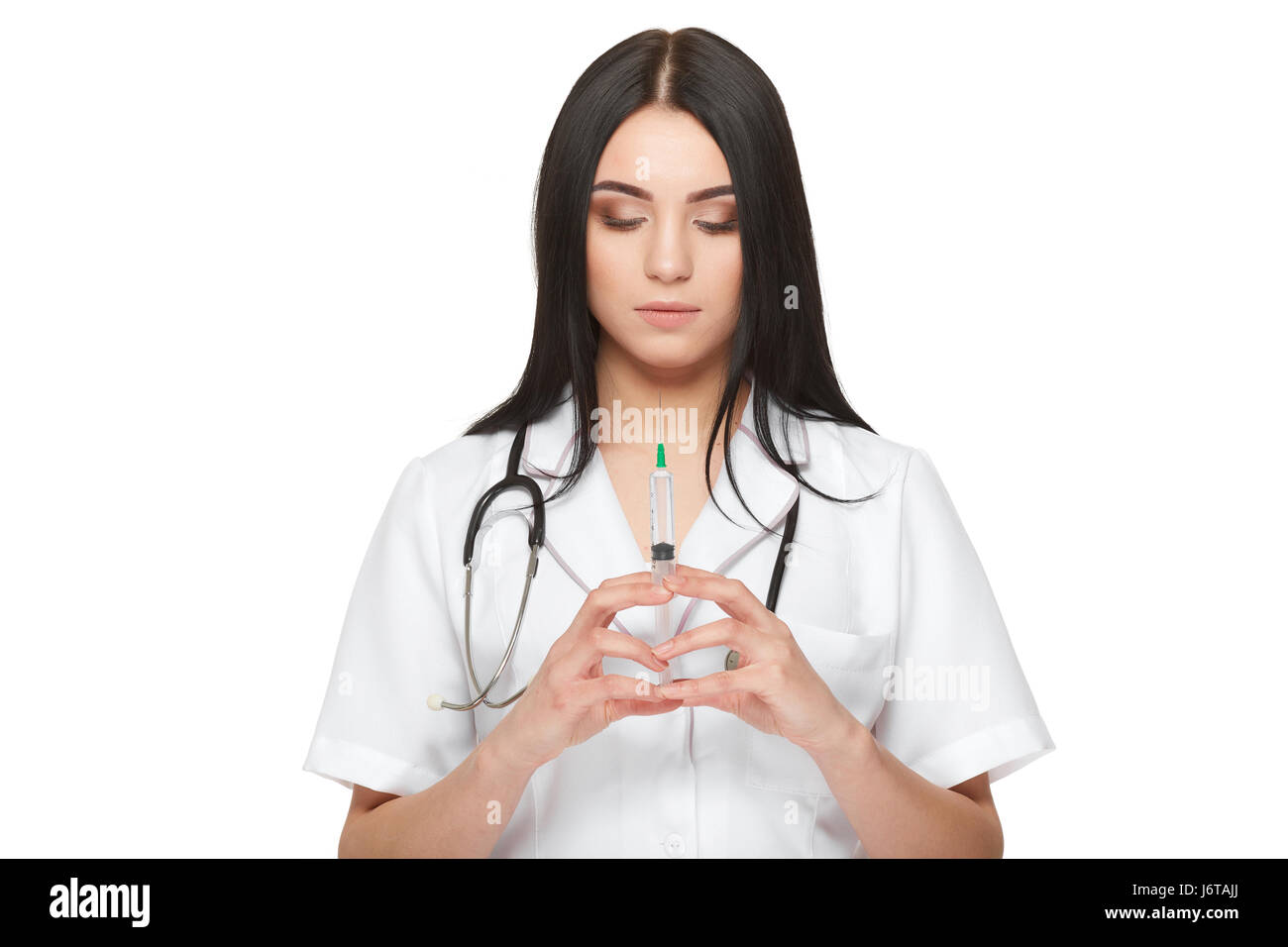 Beautiful serious nurse holding syringe with vaccine Stock Photo - Alamy
