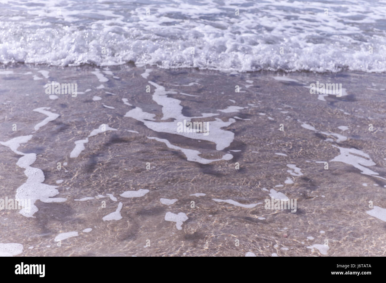 Very clear sea water, you can see the sand Stock Photo - Alamy