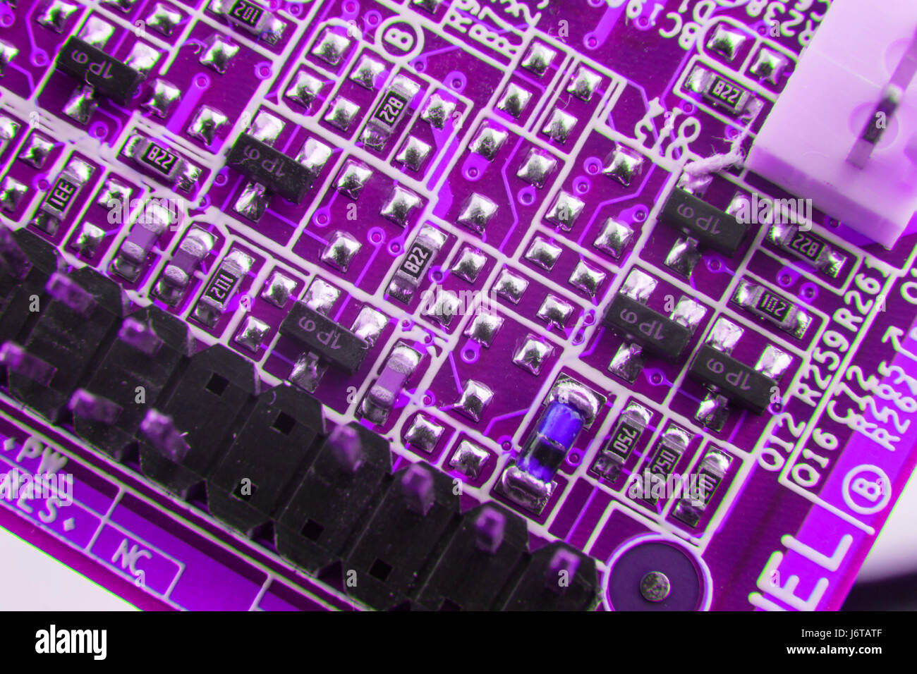 Chip on motherboard mainboard with controllers, ports and wires, close ...