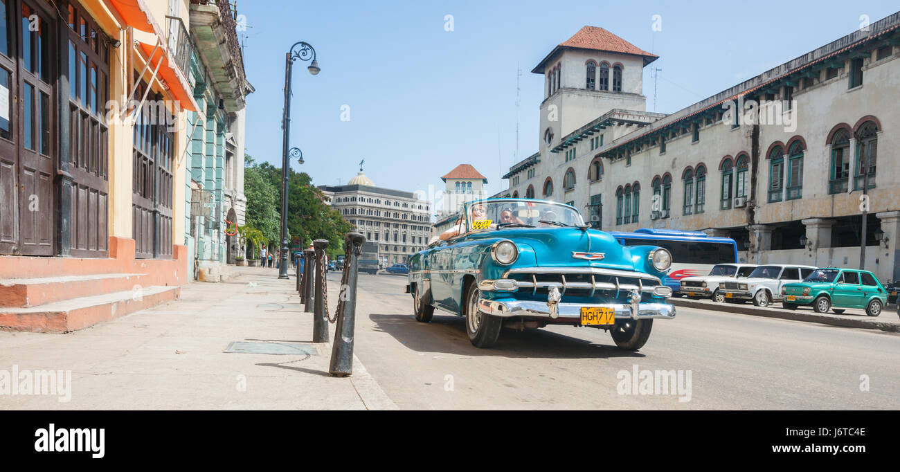 Bright blue convertible 1960's Chevrolet taxi in Havana street with ...