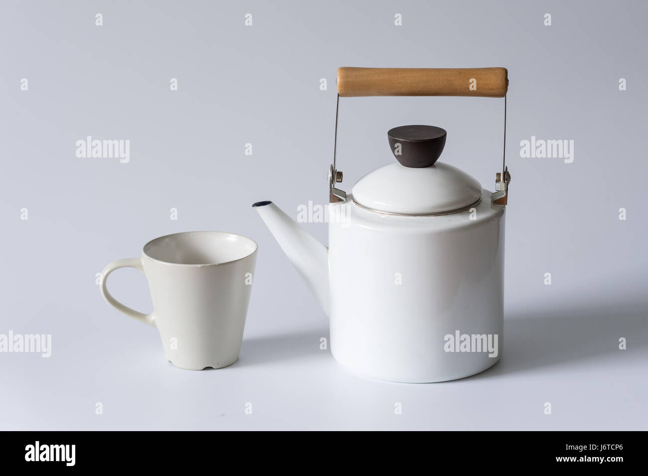 White kettles and cups, indoors Stock Photo - Alamy