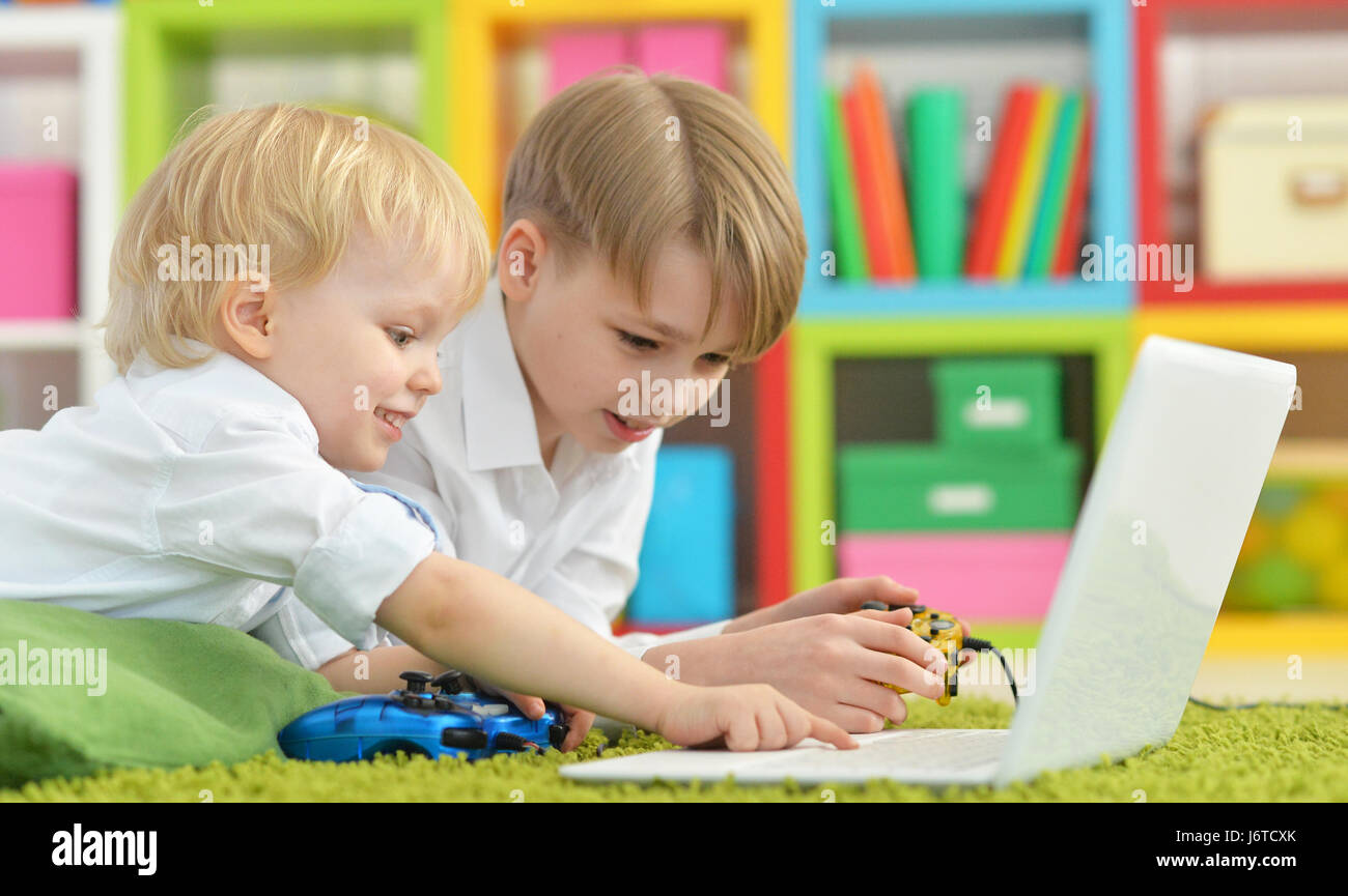 Brothers playing a computer game Stock Photo - Alamy
