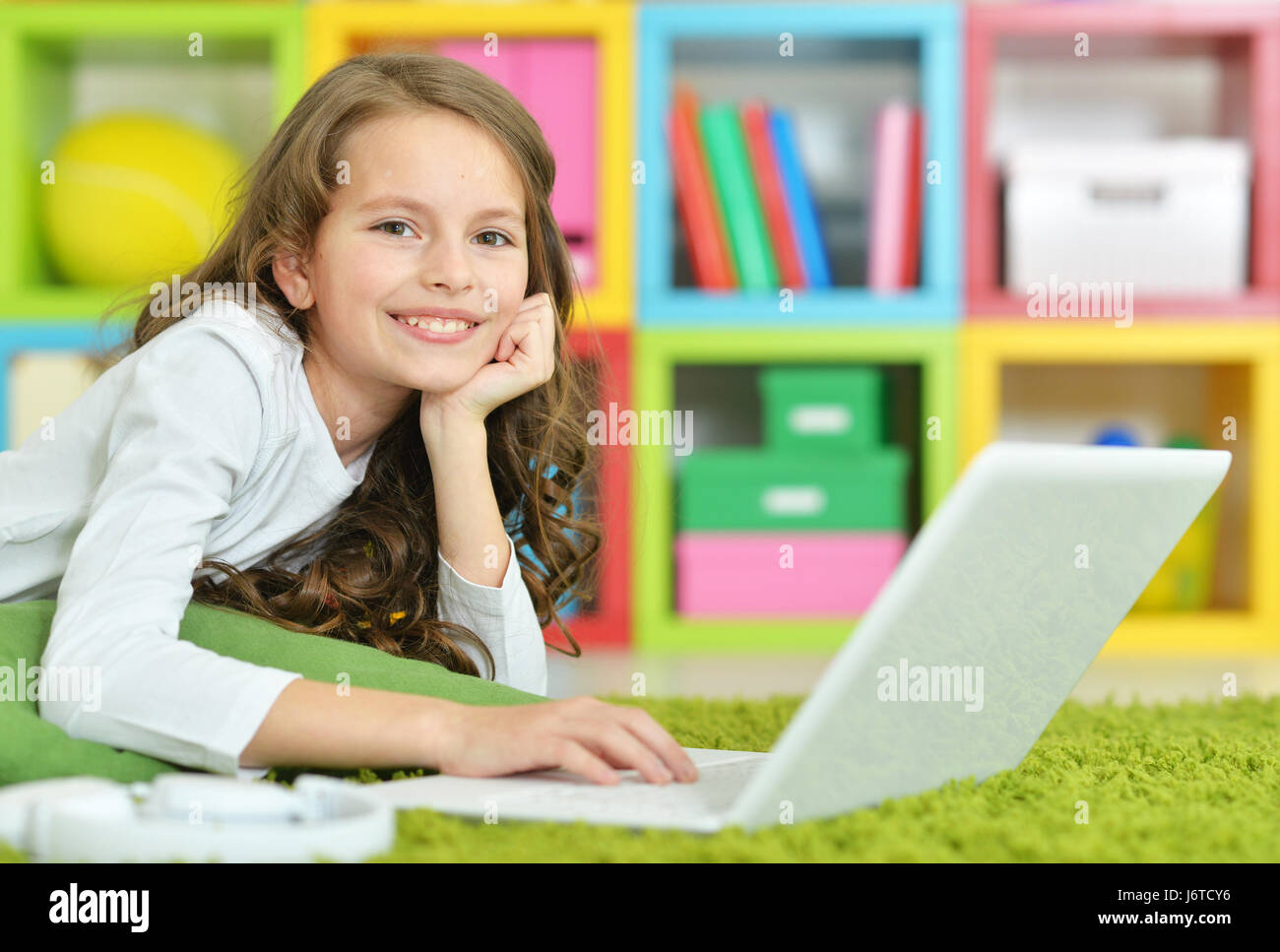 Teenage girl using a laptop Stock Photo - Alamy