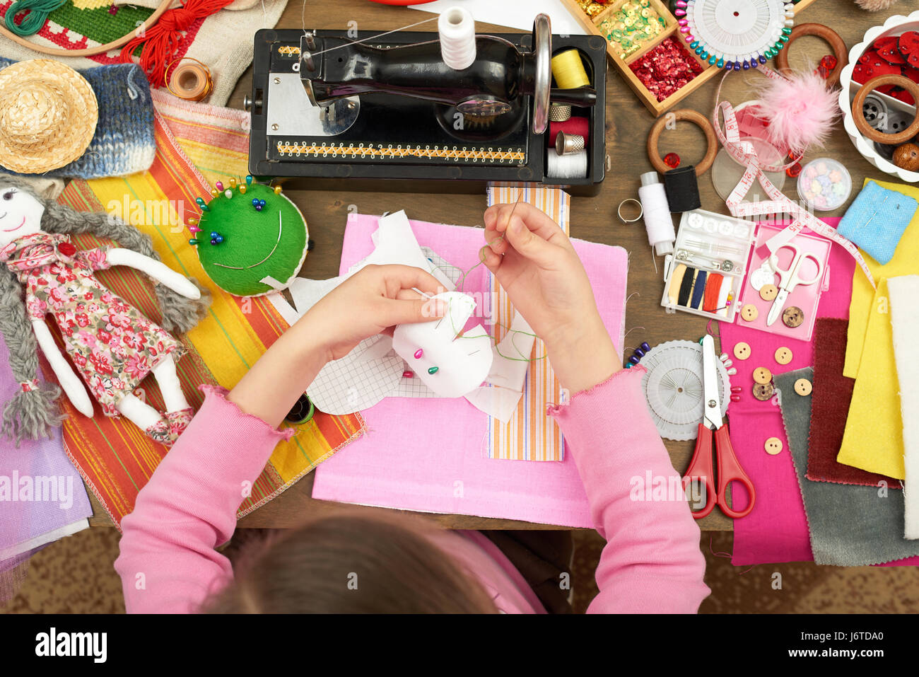 girl makes a dress template, top view, sewing accessories top view ...