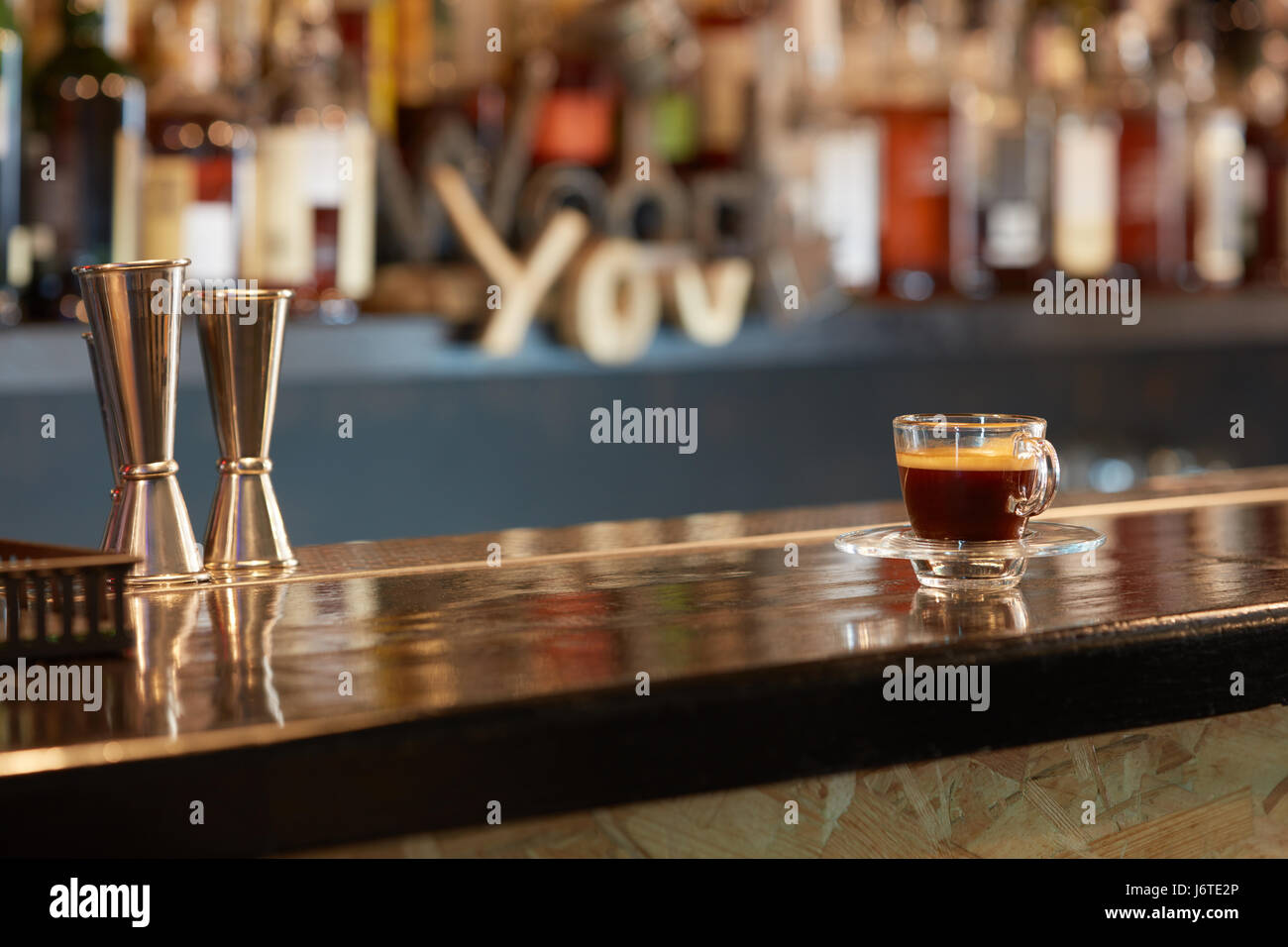 Cup of coffee on bar counter Stock Photo - Alamy