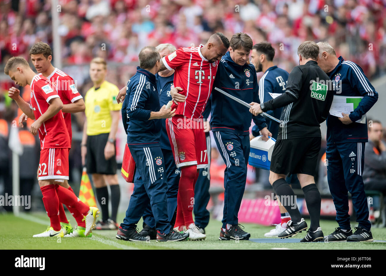 Munich's Jerome Boateng leaves the field after suffering an injury ...