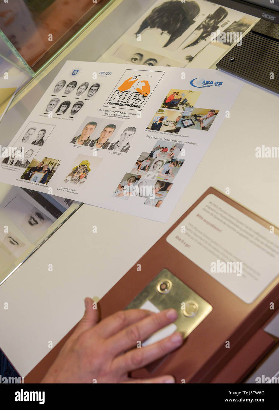 Print-outs of composite sketches on the desk of a composite sketch ...