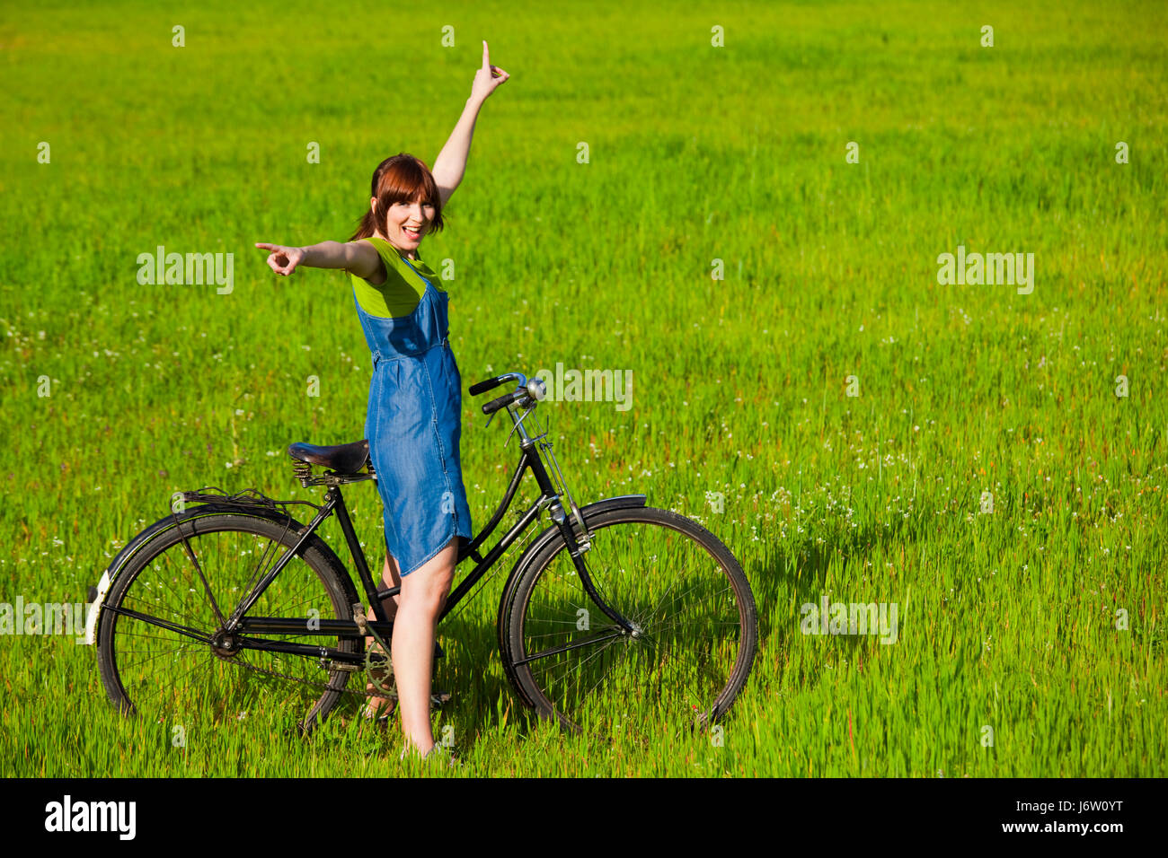 woman field spring bouncing bounces hop skipping frisks jumping jump ...