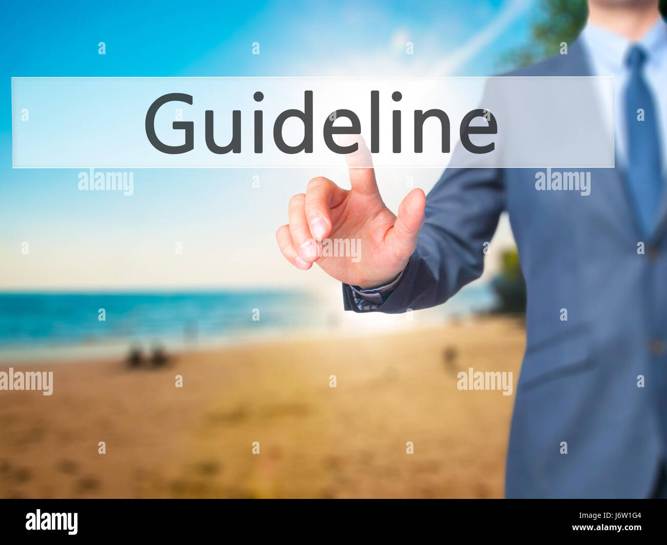 Guideline - Businessman hand pressing button on touch screen interface ...