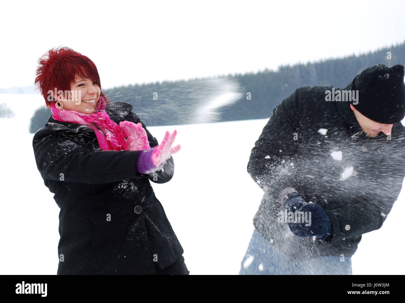 woman winter snowball fight snowball love in love fell in love couple ...
