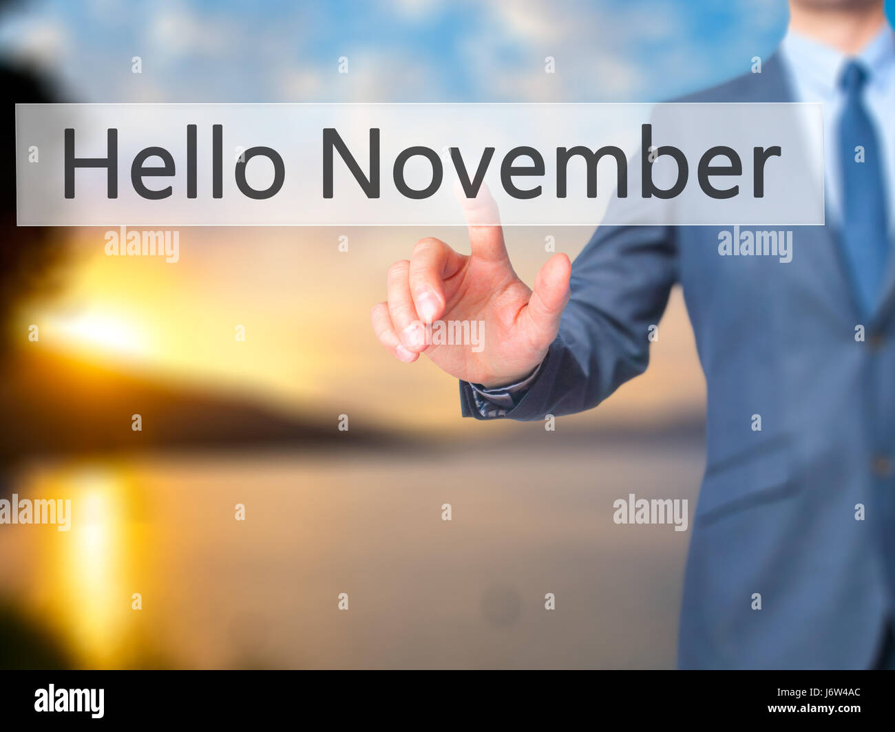 Hello November - Businessman hand pressing button on touch screen ...