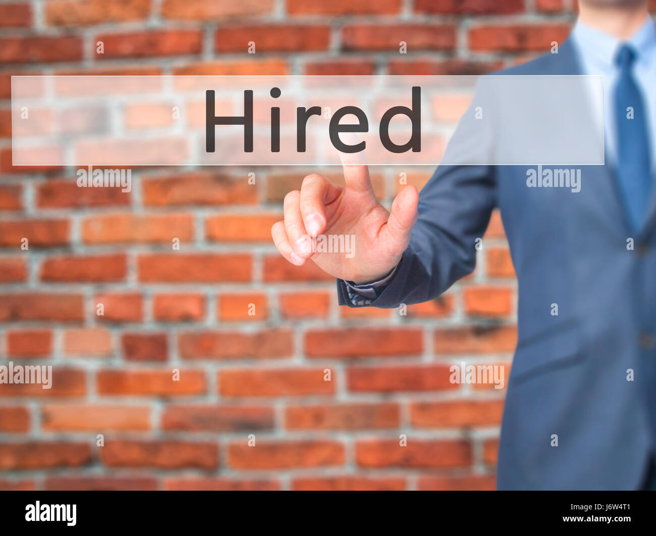 Hired - Businessman hand pressing button on touch screen interface ...