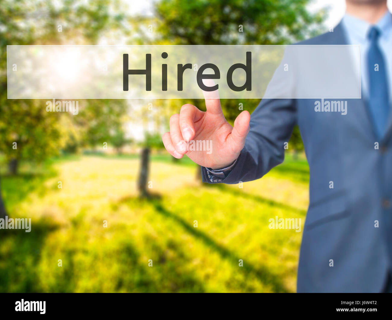 Hired - Businessman hand pressing button on touch screen interface ...