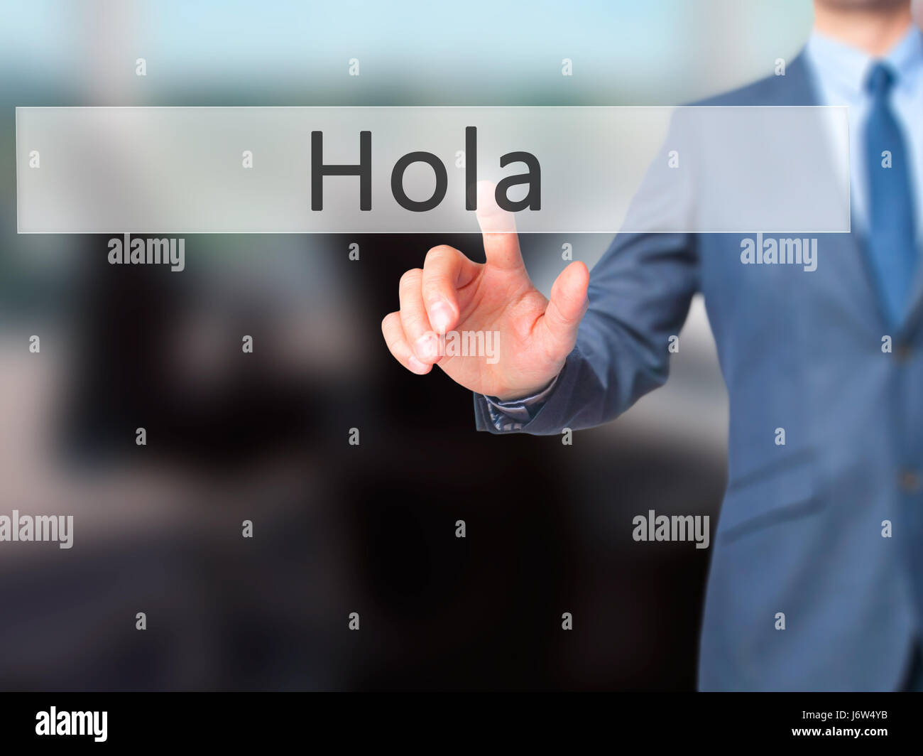 Hola - Businessman hand pressing button on touch screen interface ...