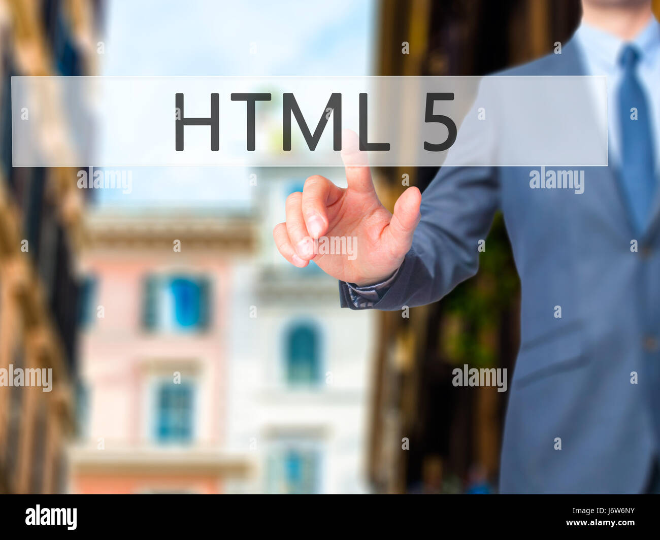 HTML 5 - Businessman hand pressing button on touch screen interface. Business, technology ...