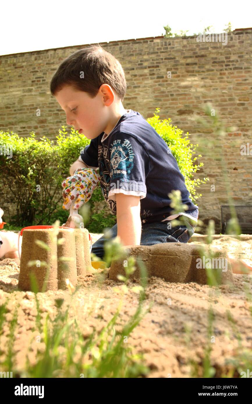 boy playing in the sand Stock Photo - Alamy