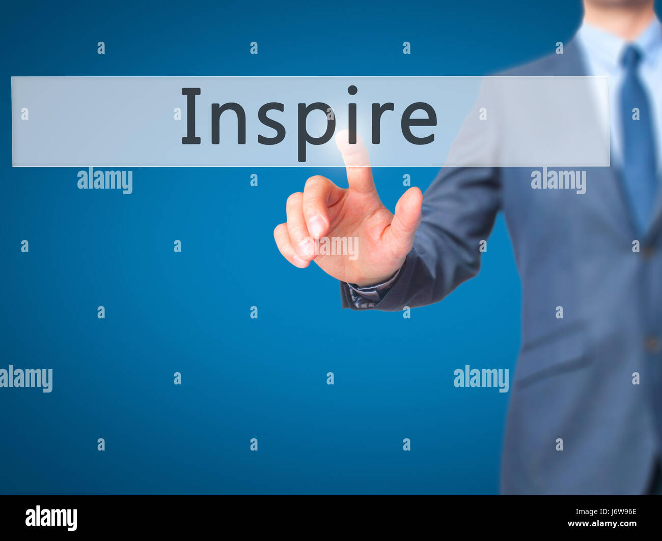 Inspire - Businessman hand pressing button on touch screen interface ...