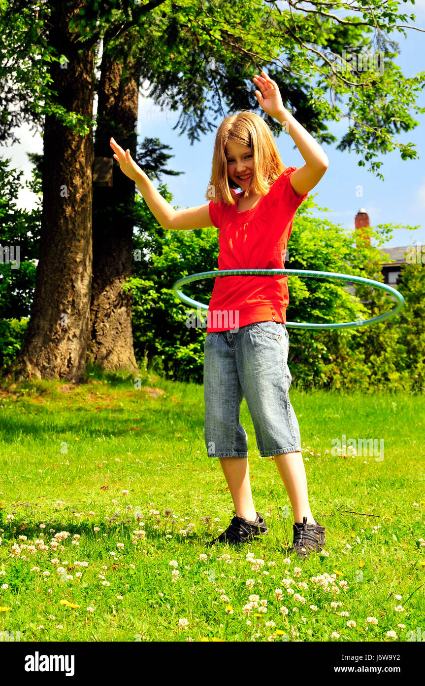 child in the garden jumping jumping Stock Photo - Alamy