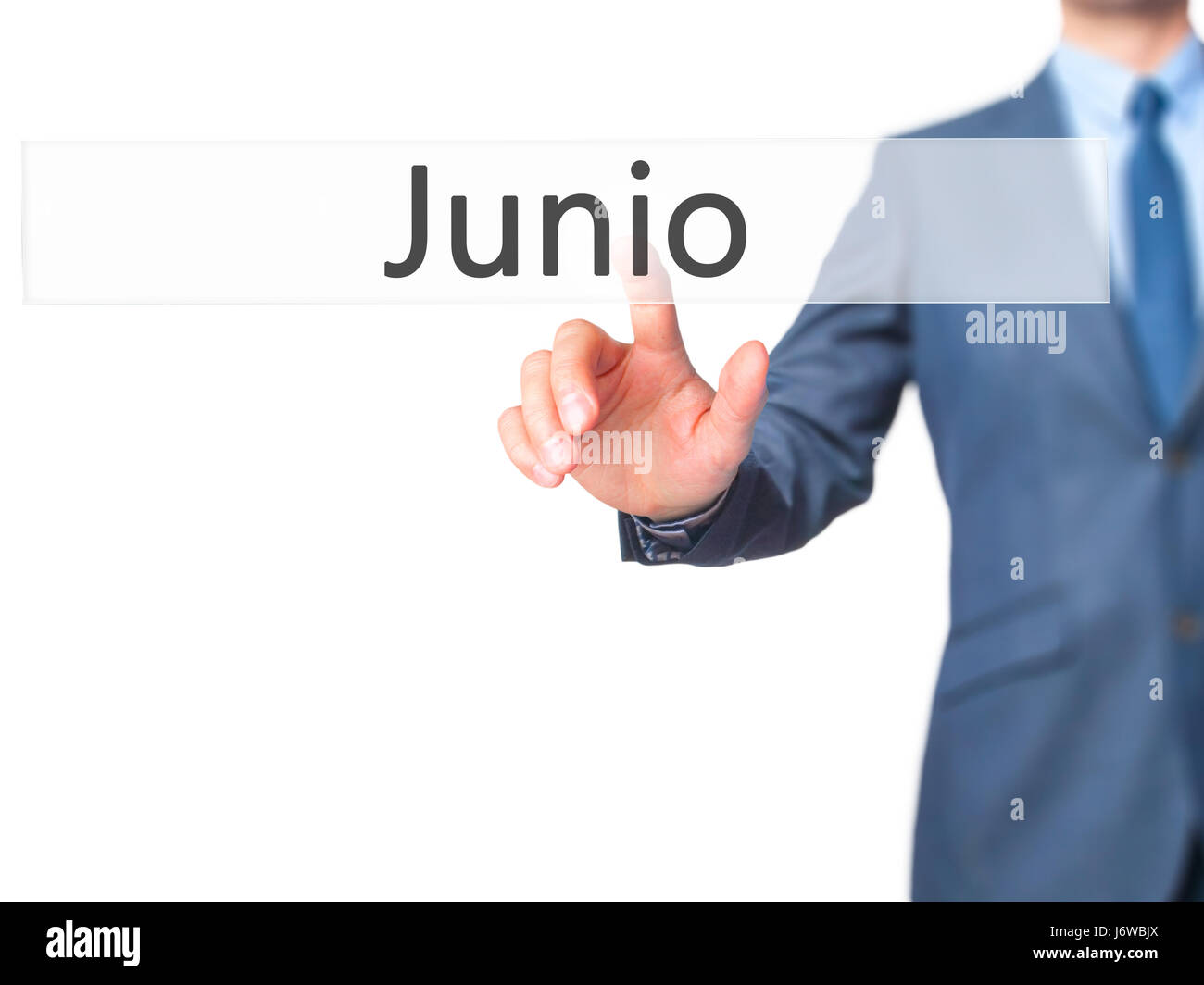 Junio (June in Spanish) - Businessman hand touch button on virtual ...