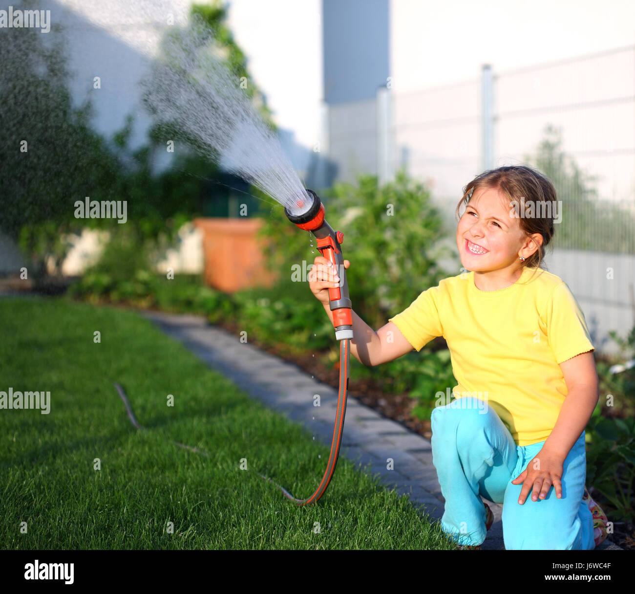 garden outdoor gardening planting helping child watering irrigation ...