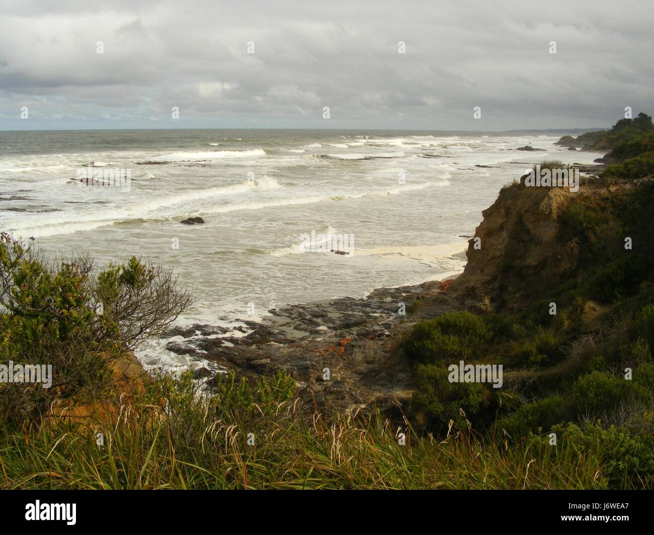 rock coast new zealand stormy undulate salt water sea ocean water ...