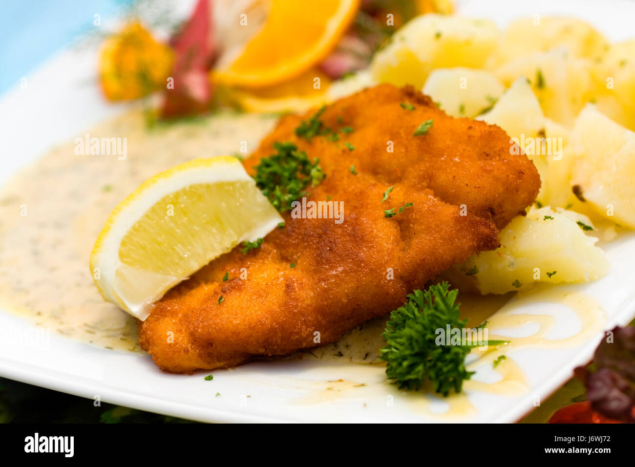 deep fried fresh cod fish with potato and sauce Stock Photo - Alamy