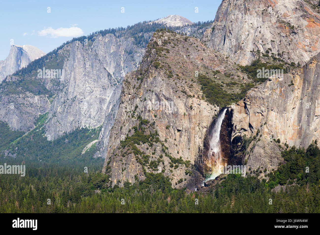 Waterfall over Cliff into forest Yosemite Valley Stock Photo - Alamy