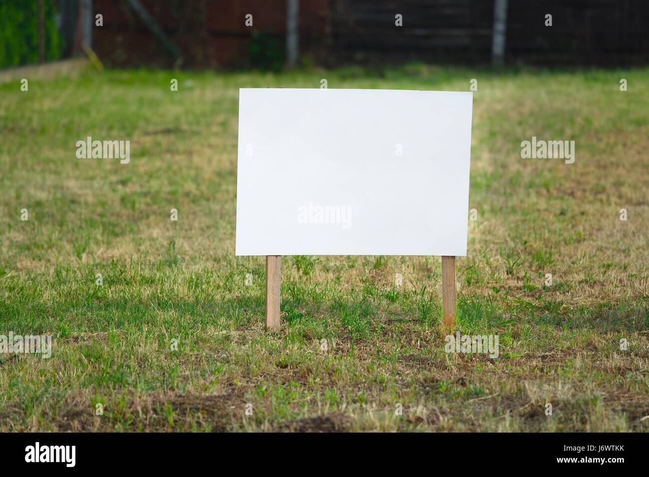 Empty signboard on a piece of ground Stock Photo - Alamy