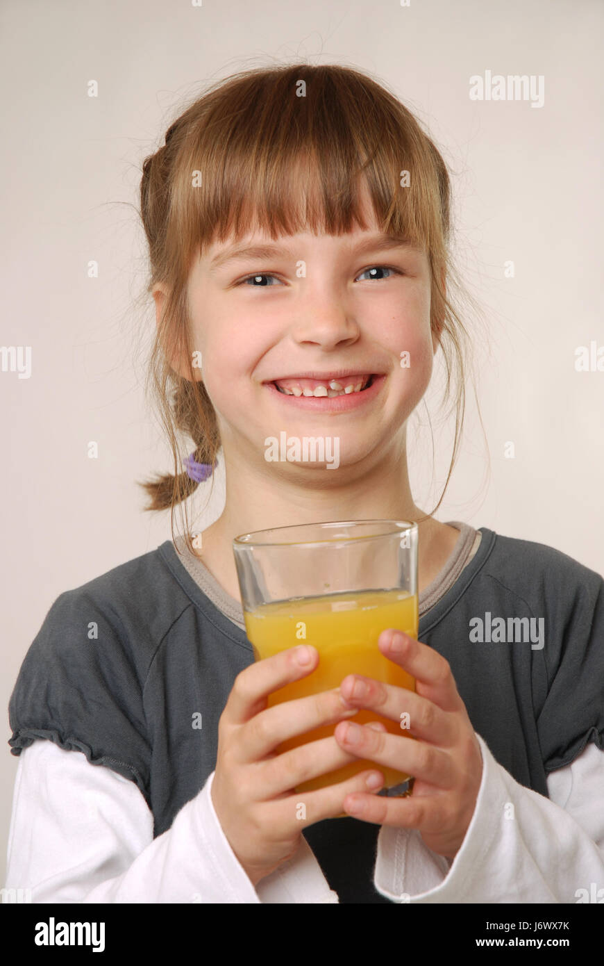 Girls blond glass juice hi-res stock photography and images - Alamy