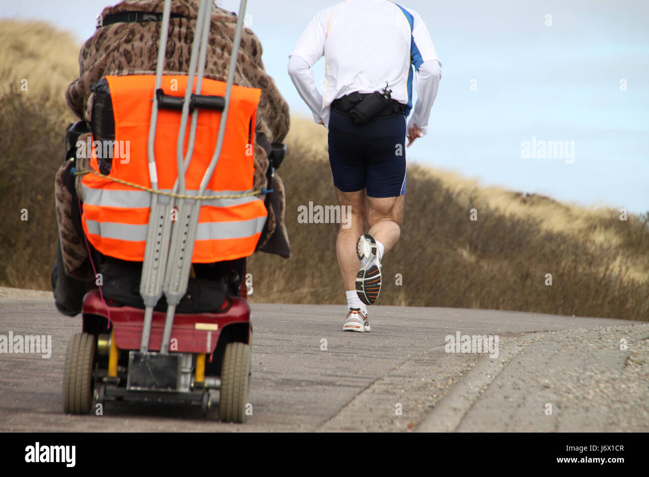 runners and wheelchair user Stock Photo - Alamy