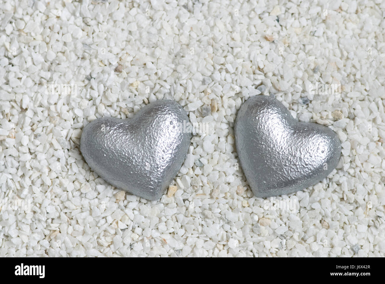 two silver hearts Stock Photo - Alamy