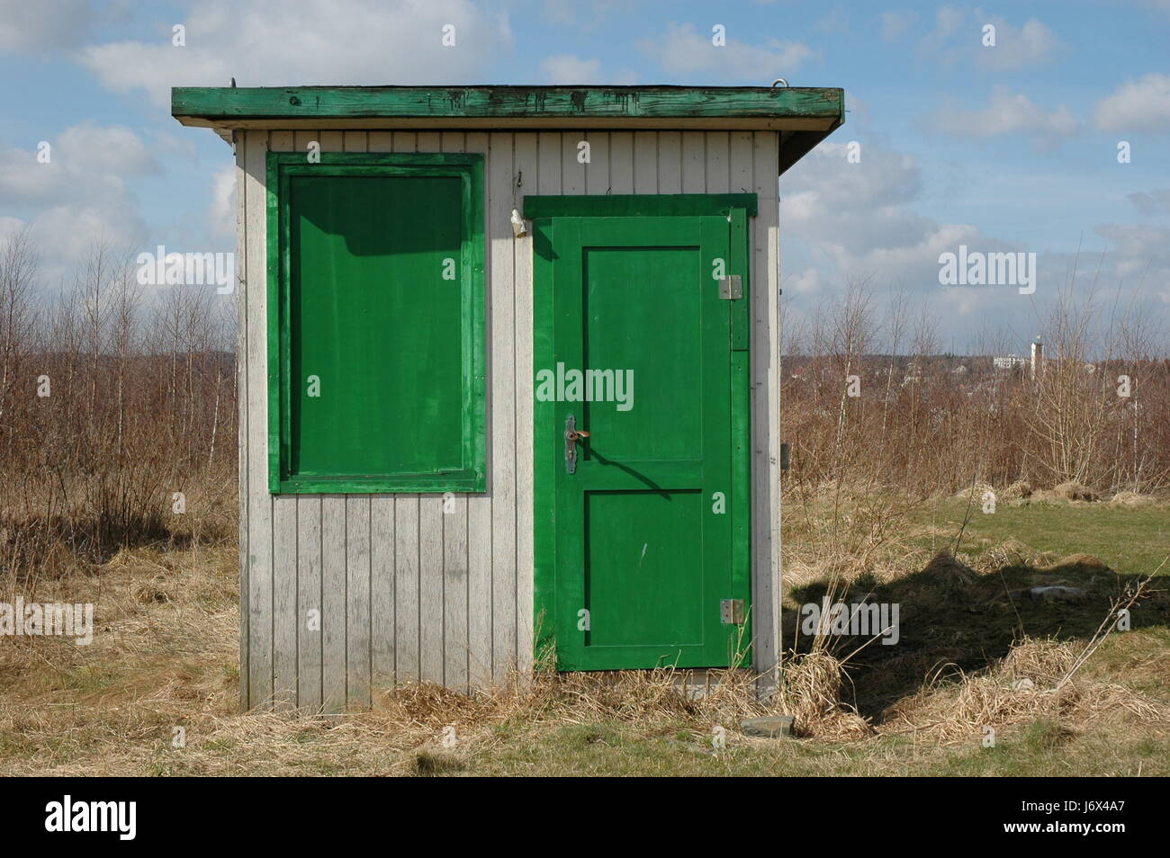 tiny cottage in the open field Stock Photo - Alamy