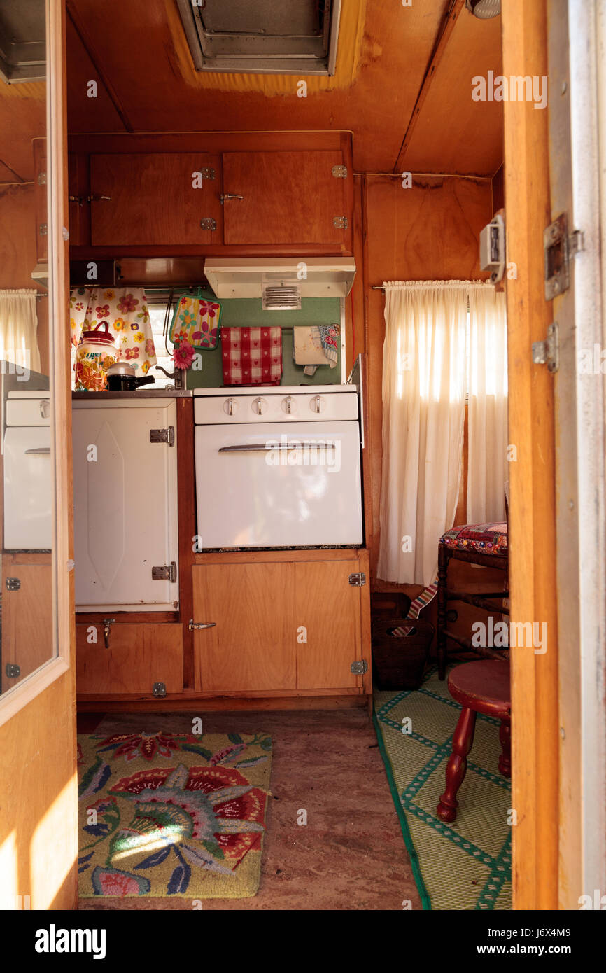 Small retro caravan camper used as a tiny house on road trips to the ...