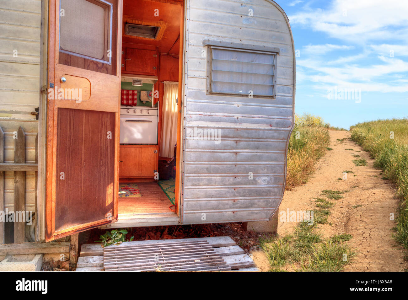 Small retro caravan camper used as a tiny house on road trips to the ...
