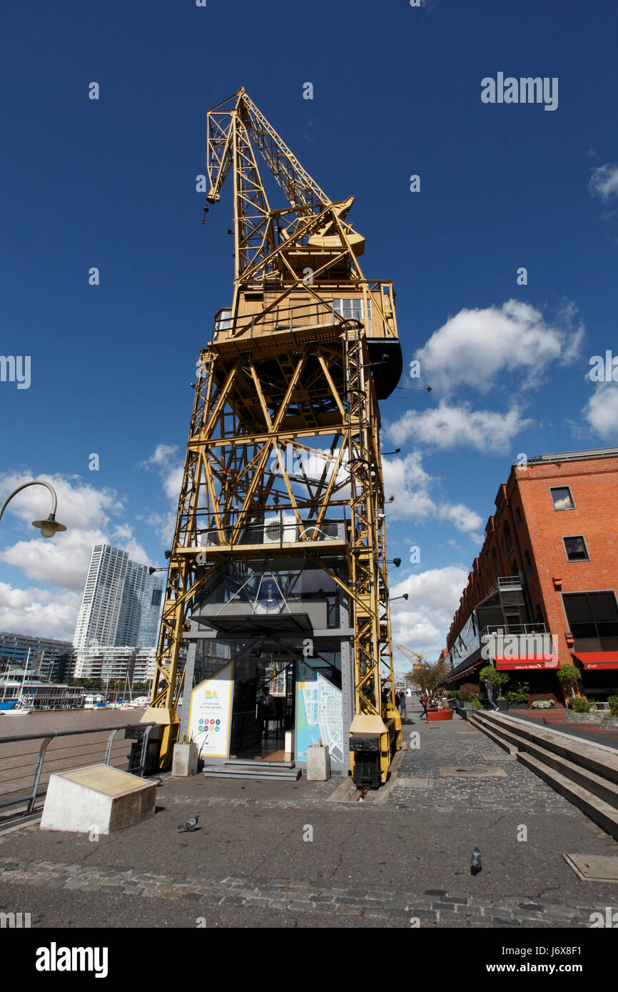 Old yellow cargo cranes alongside the dock at Puerto Madero, Buenos ...