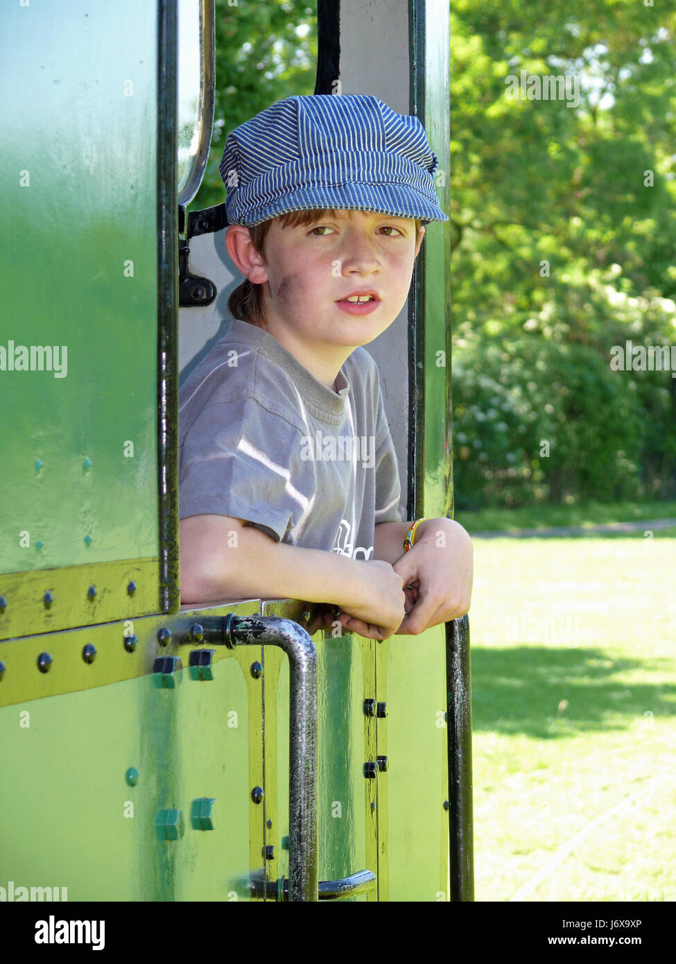 boy on steam locomotive Stock Photo - Alamy