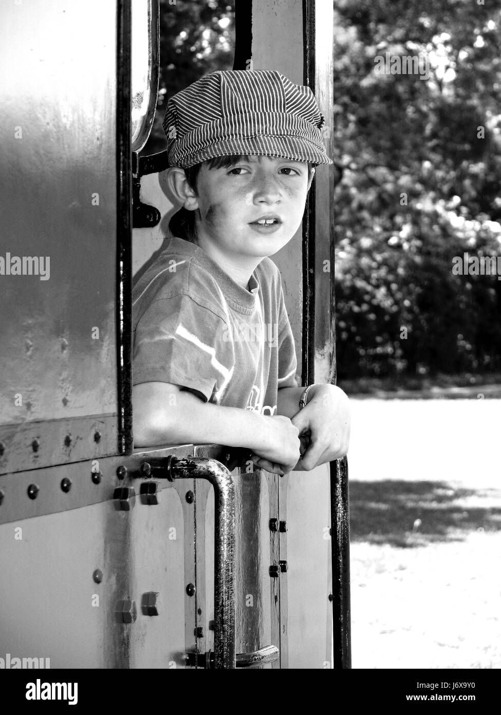boy on steam locomotive Stock Photo - Alamy