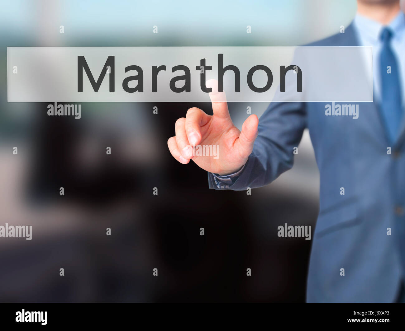 Marathon - Businessman hand pressing button on touch screen interface ...