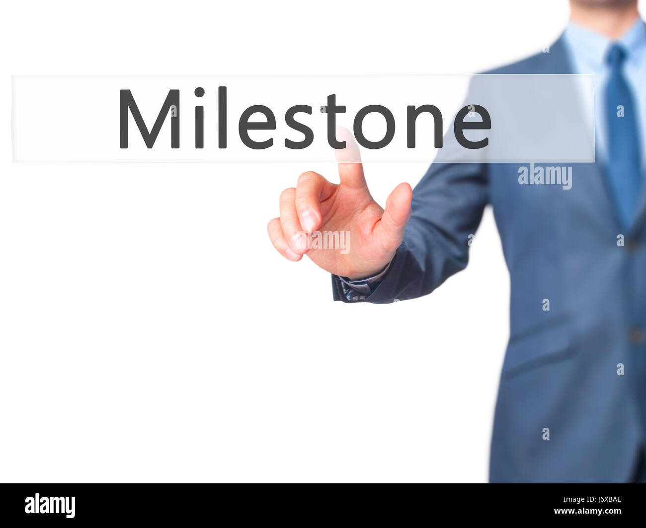 Milestone - Businessman hand pressing button on touch screen interface ...