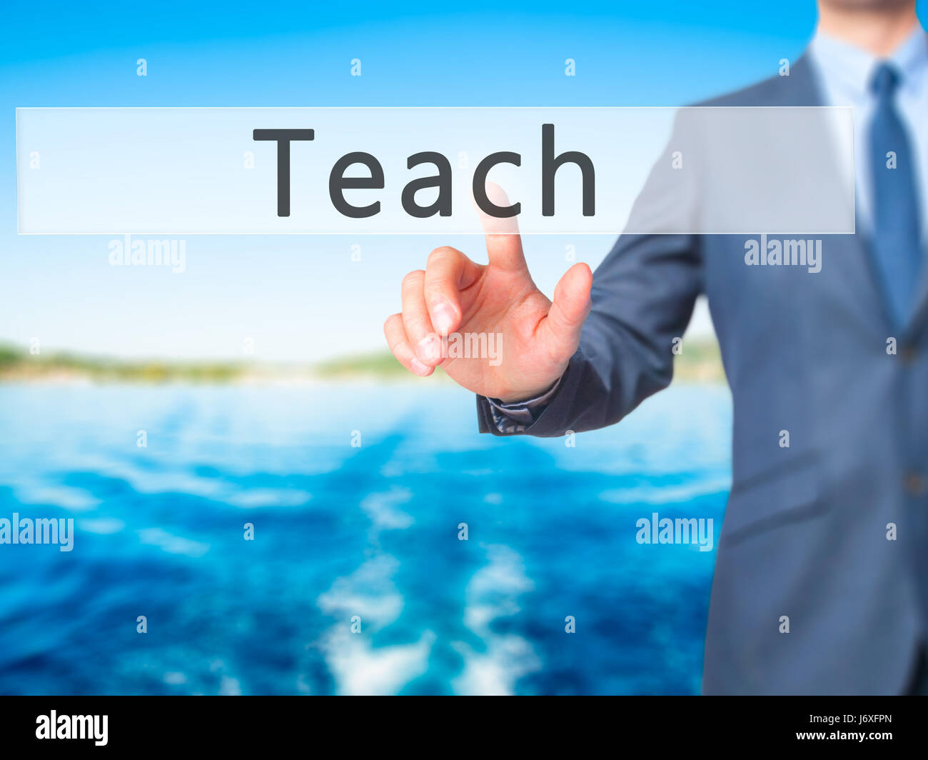 Teach - Businessman hand pressing button on touch screen interface ...